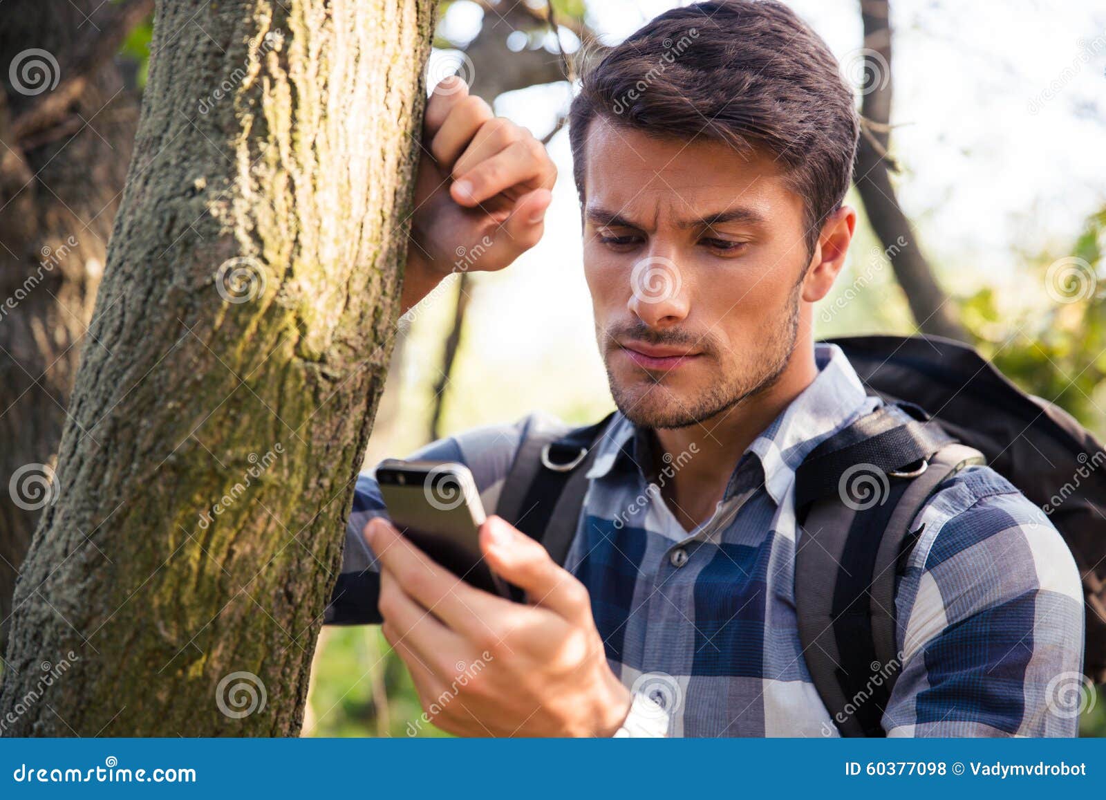 Man Using Smartphone in the Forest Stock Photo - Image of male ...