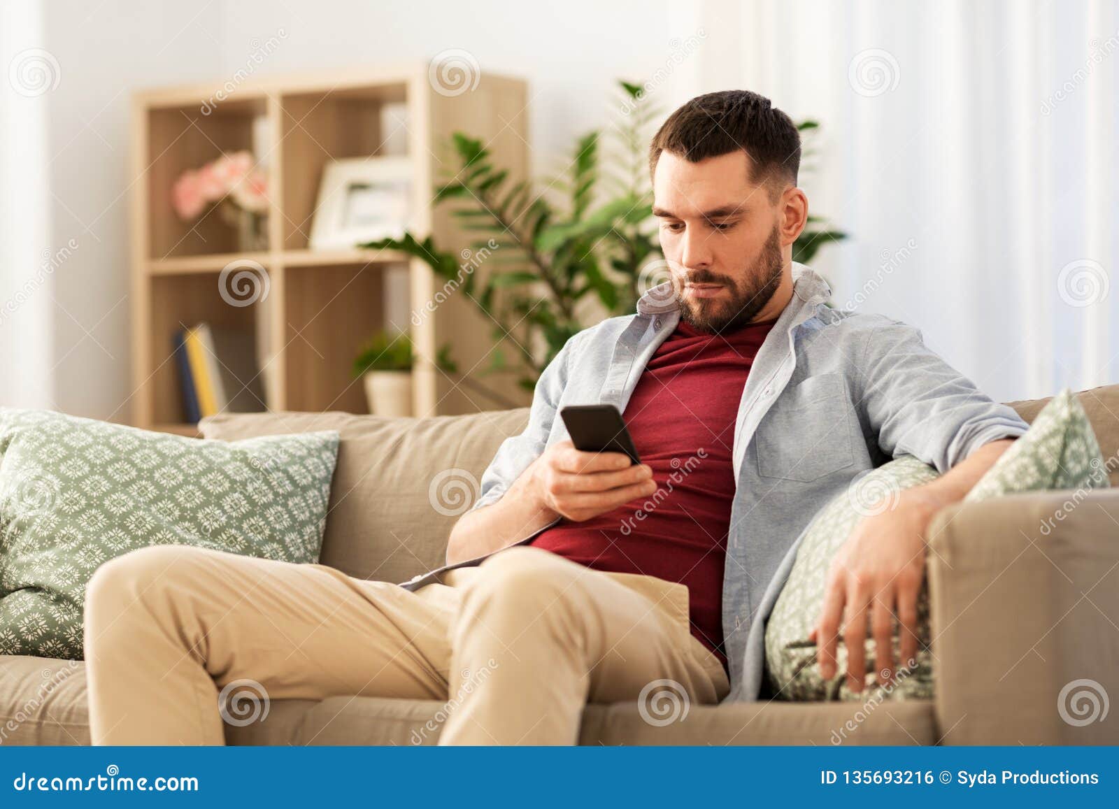 Man Using Smartphone at Home Stock Photo - Image of hispanic, adult ...