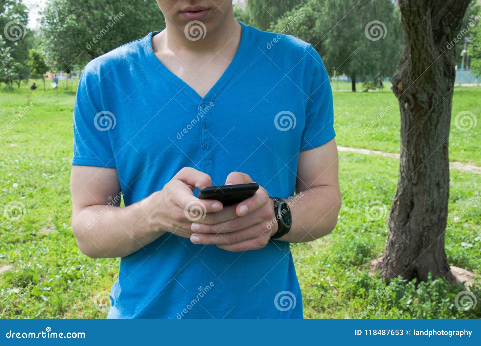 Man Using a Smartphone. Looking at Device Stock Image - Image of ...