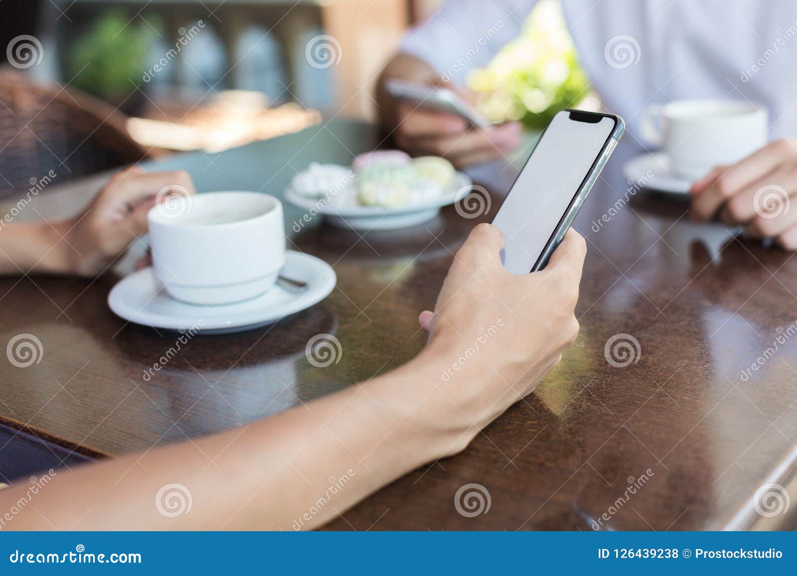Man Using Smartphone while Relaxing at Cafe Stock Photo - Image of ...