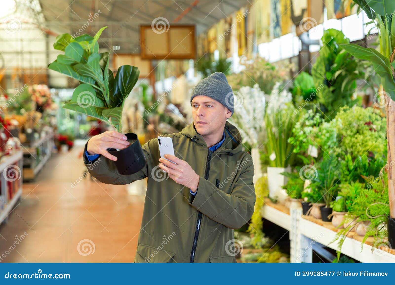 Man Using Smartphone Scans Barcode on Flower Pot Stock Image - Image of ...
