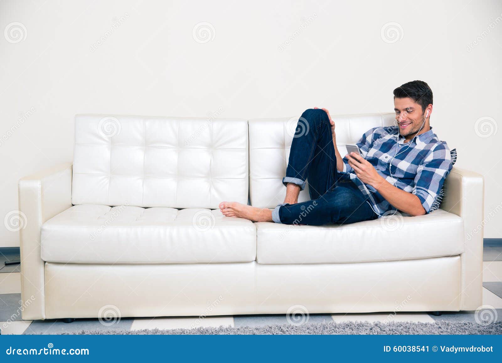 Man Using Smartphone on the Sofa Stock Image - Image of apps ...