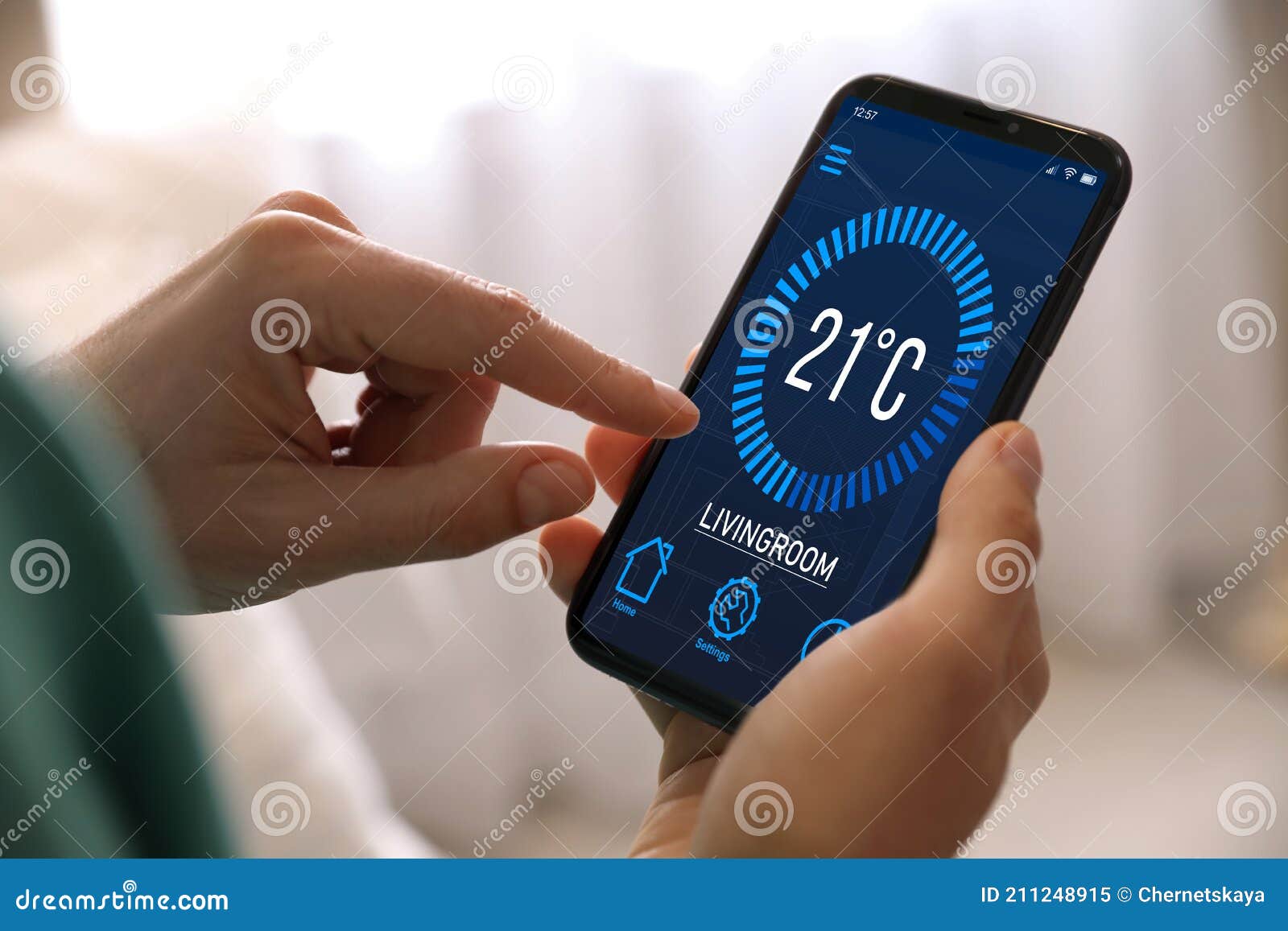 Man Using Smartphone To Control Heating System in House, Closeup Stock ...