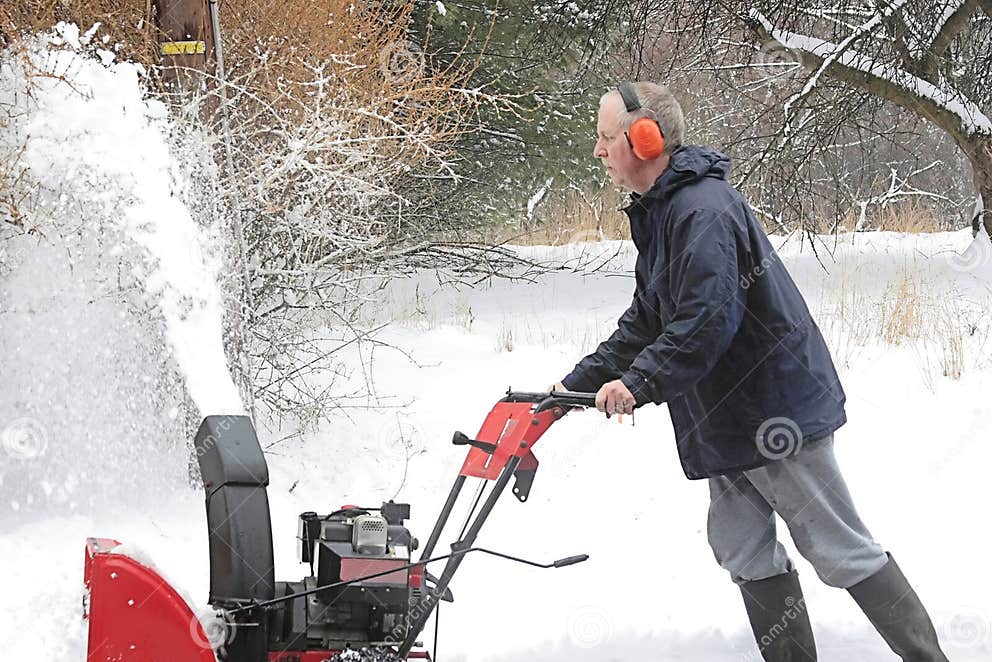 Man Using a Snow Blower stock image. Image of thrower - 7375311