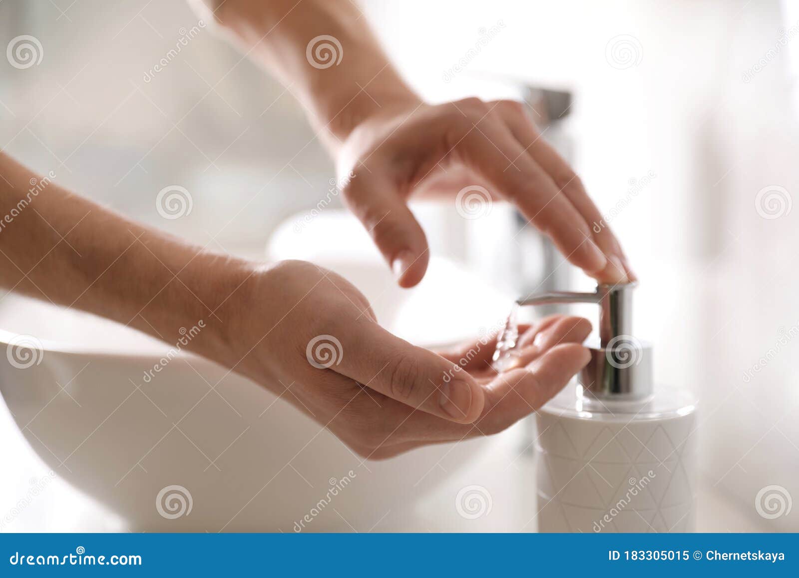 Man Using Soap Dispenser in Bathroom Stock Image - Image of cleaning ...