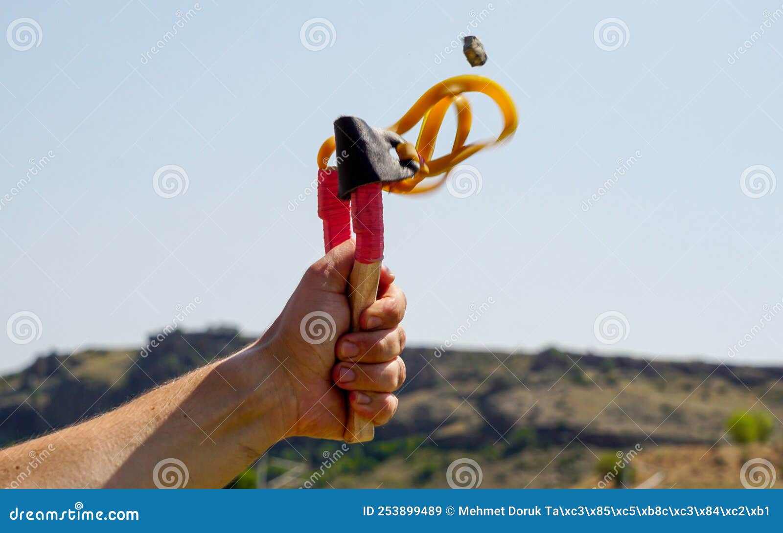 Man Using Spear Thrower Throwing Rock Nature Amusement Stock Image ...