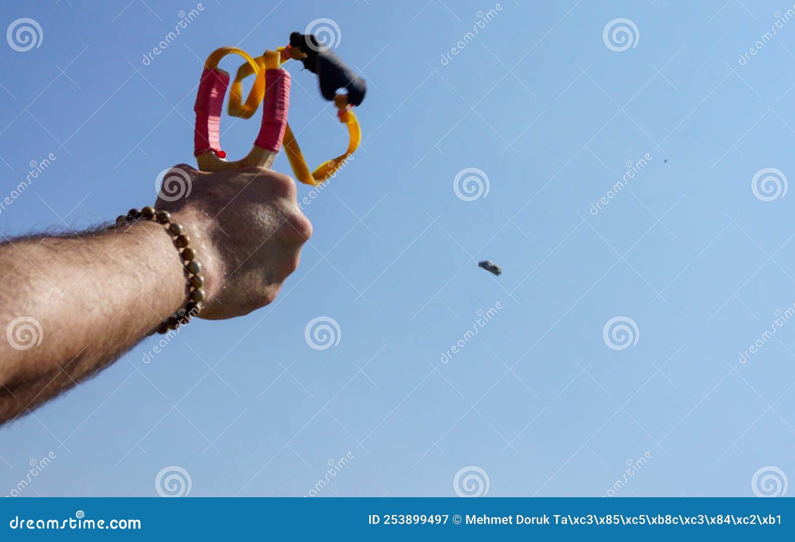 Man Using Spear Thrower Throwing Rock Nature Amusement Stock Image ...