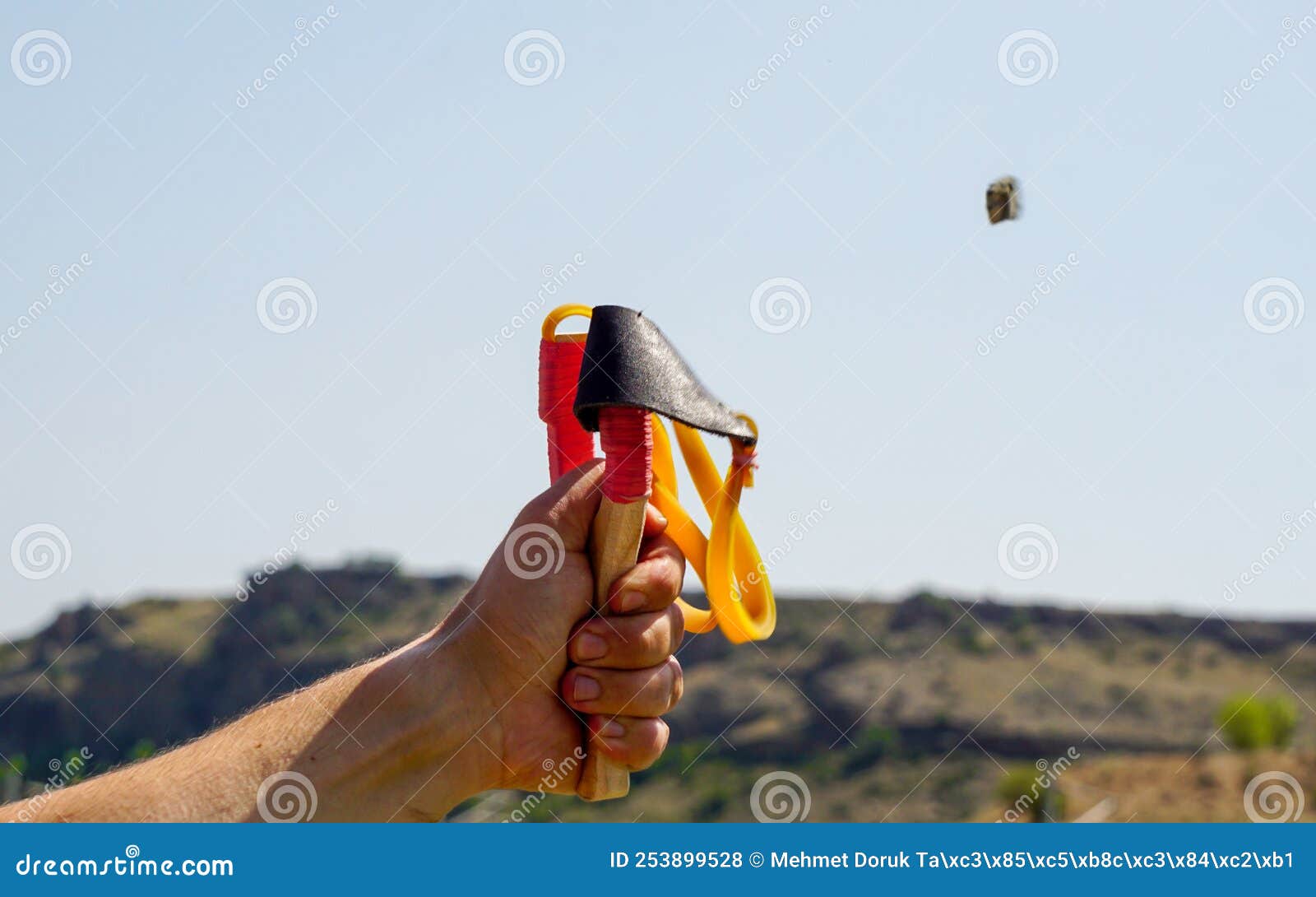 Man Using Spear Thrower Throwing Rock Nature Amusement Stock Photo ...