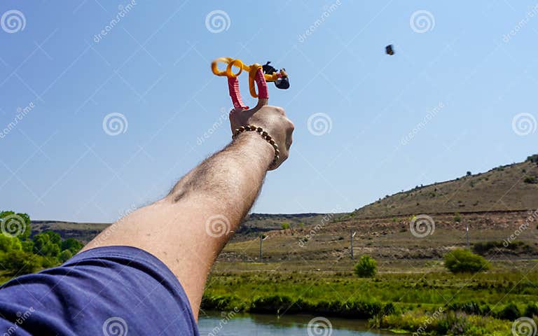 Man Using Spear Thrower Throwing Rock Nature Amusement Stock Photo ...