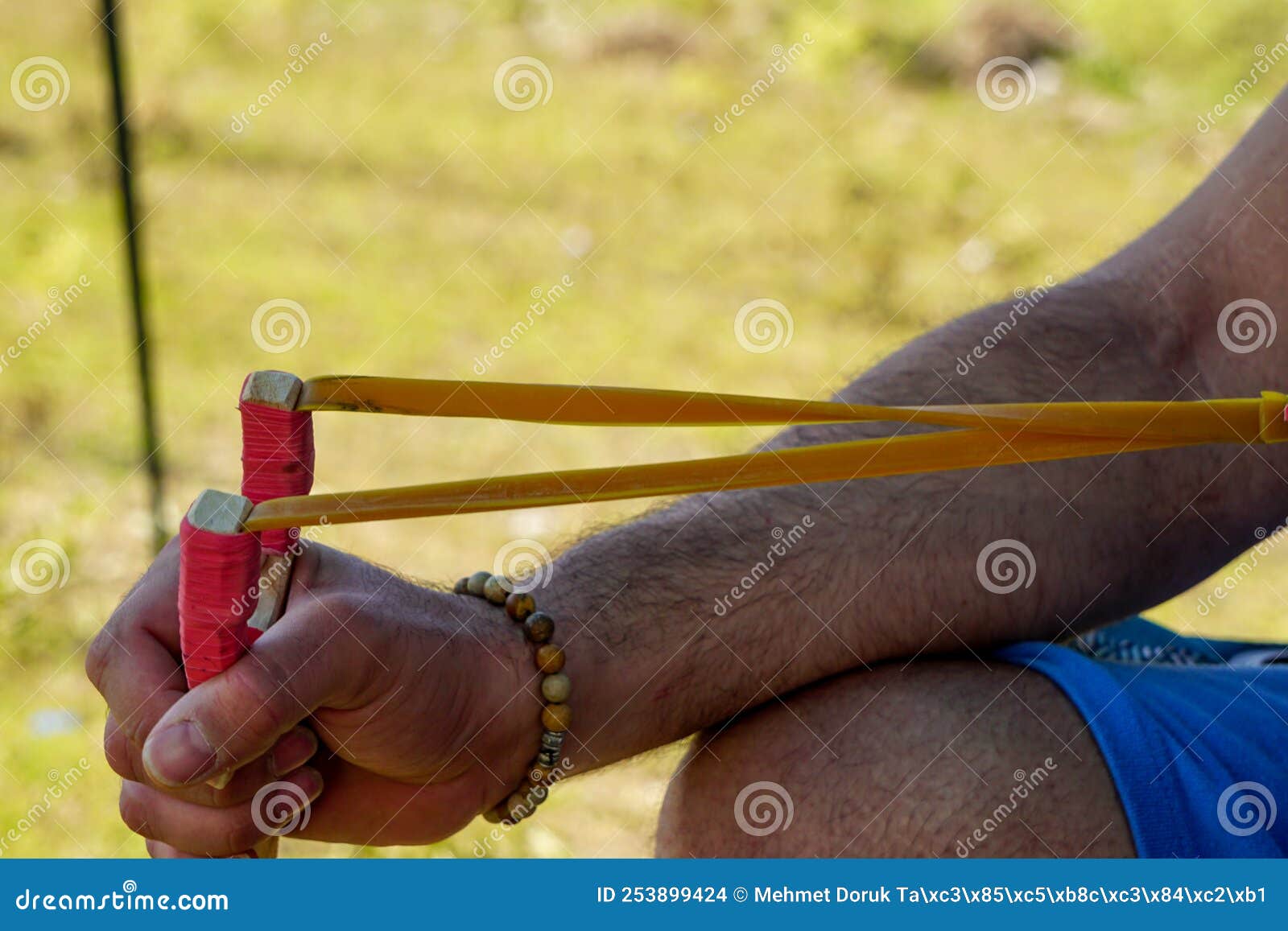 Man Using Spear Thrower Throwing Rock Nature Amusement Stock Photo ...