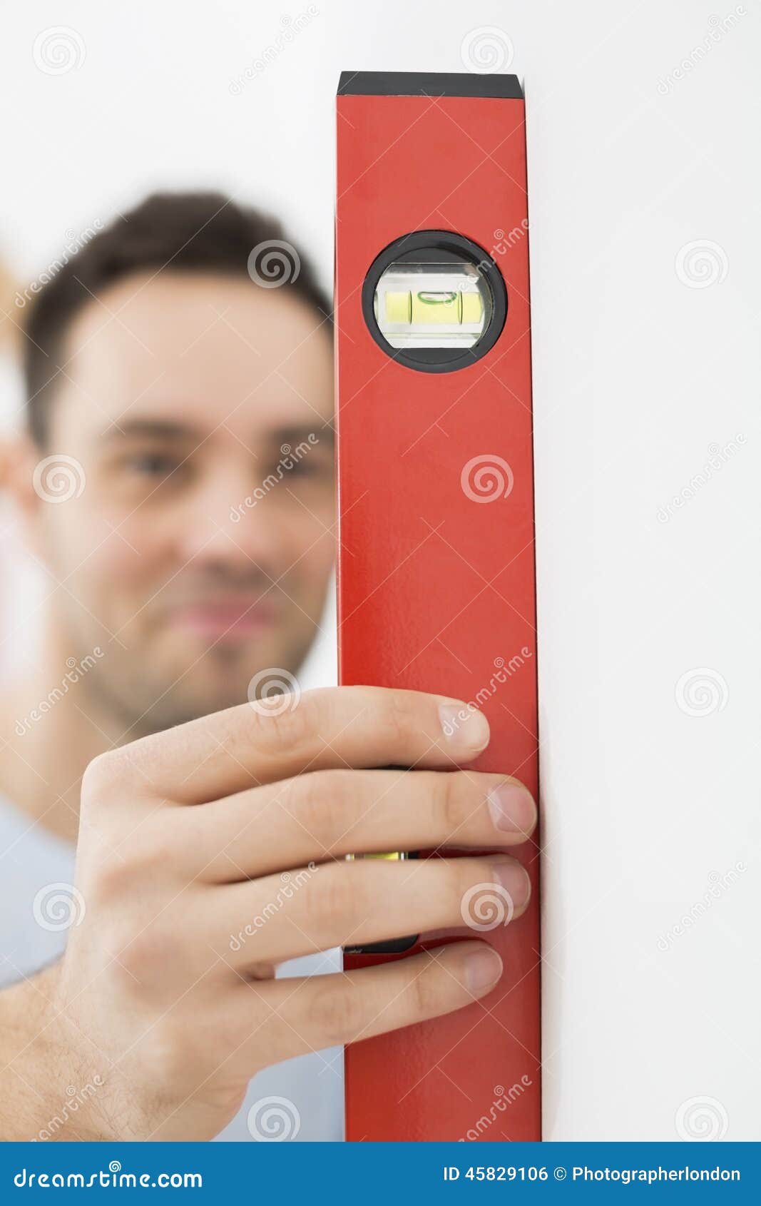 Man Using Spirit Level in New House Stock Photo - Image of level ...