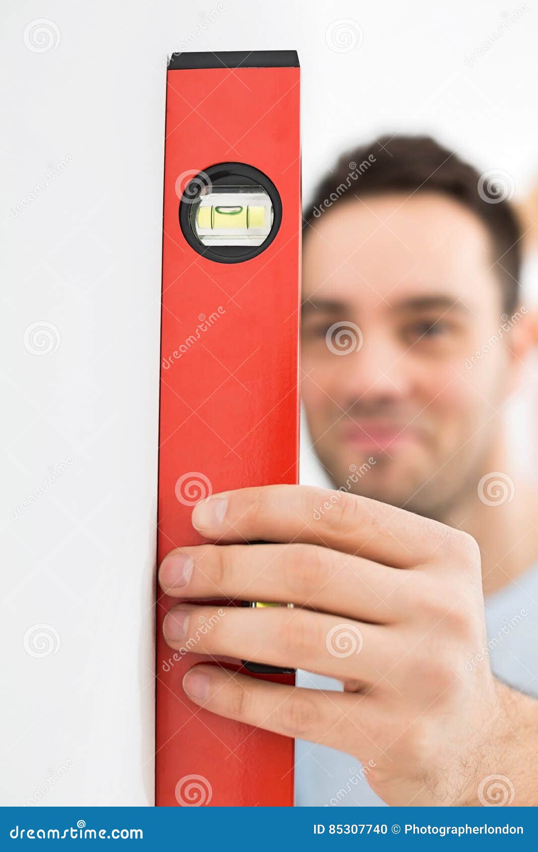 Man Using Spirit Level in New House Stock Photo - Image of people, home ...