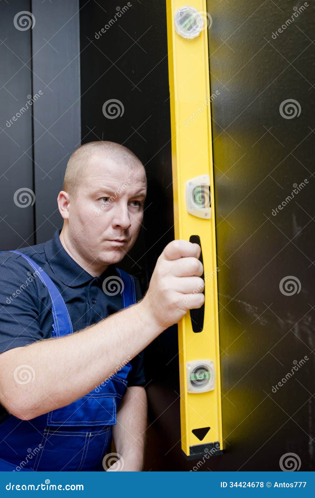 Man using a spirit level stock photo. Image of male, level - 34424678