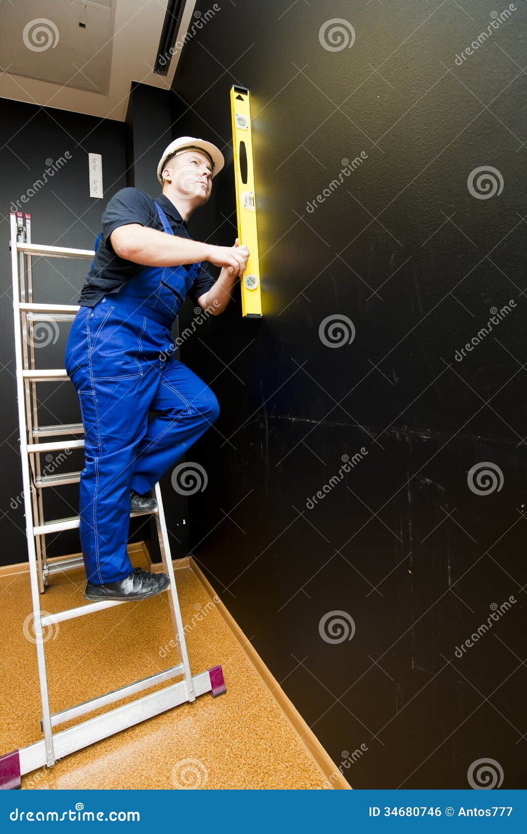 Man using a spirit level stock photo. Image of building - 34680746