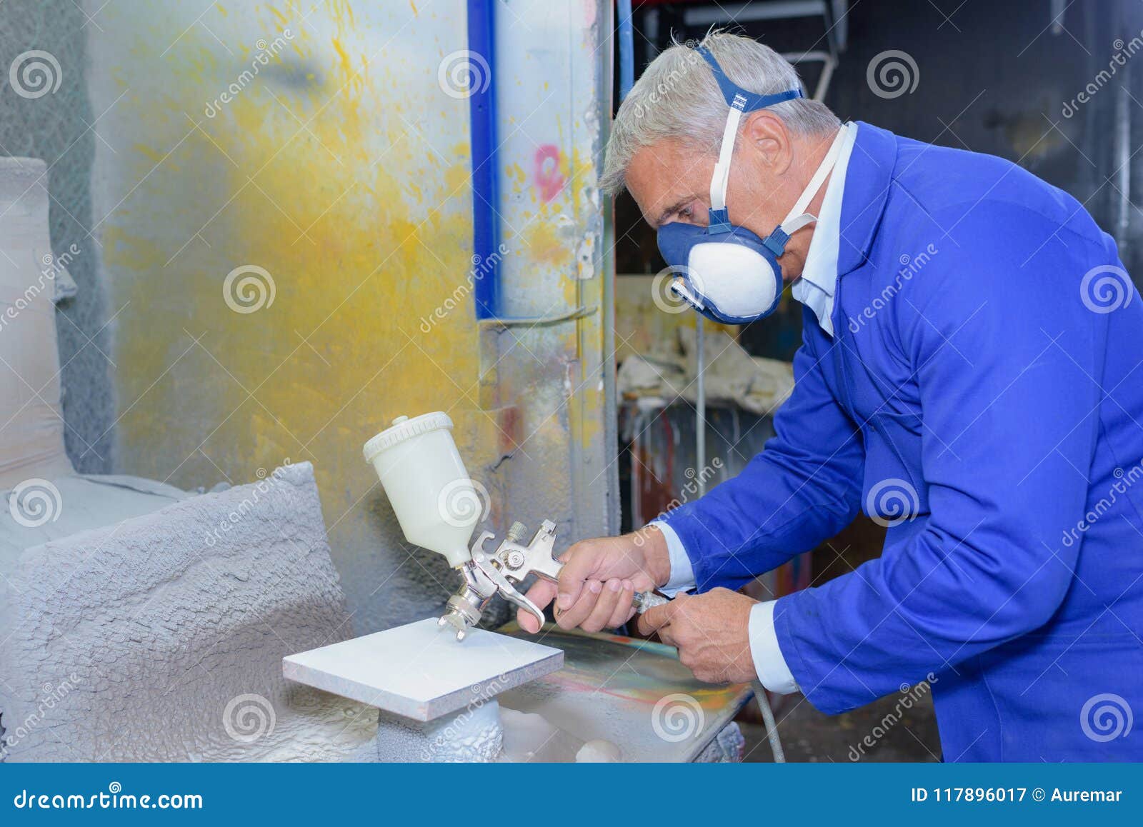 Man using spray paint gun stock image. Image of fumes - 117896017