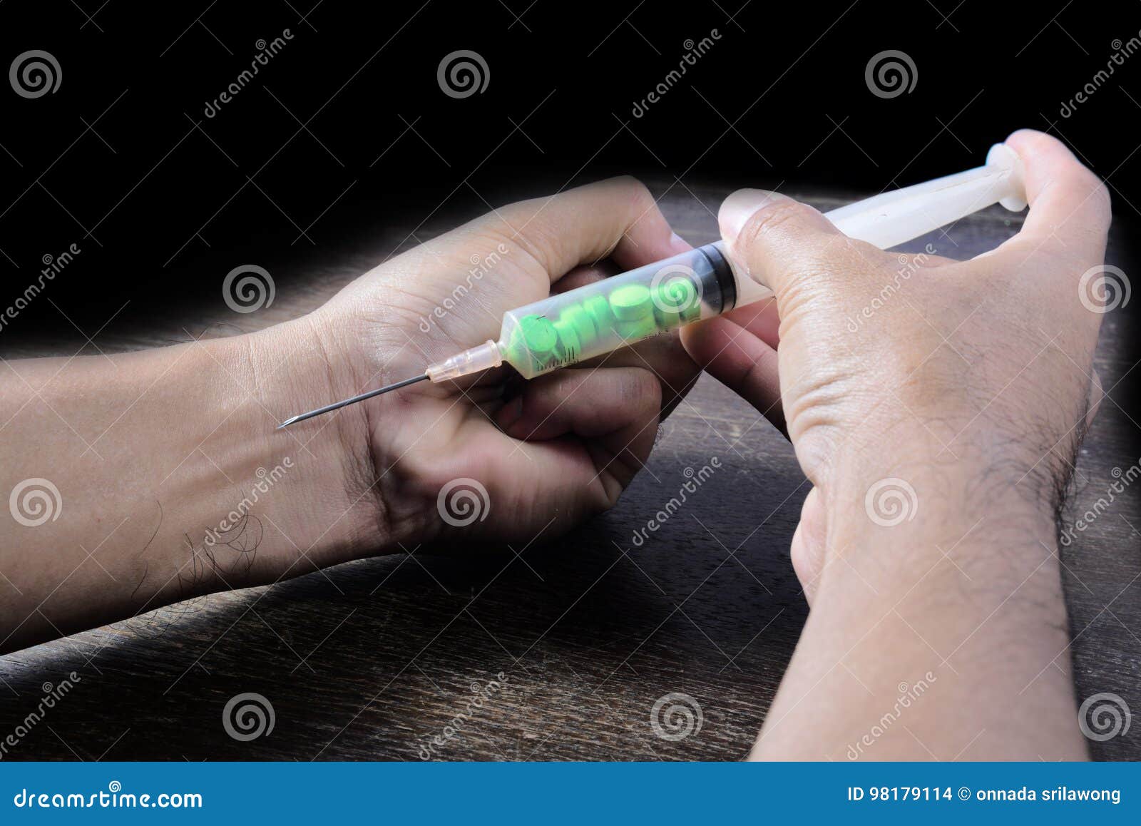 A man is using a syringe. stock photo. Image of syringe - 98179114