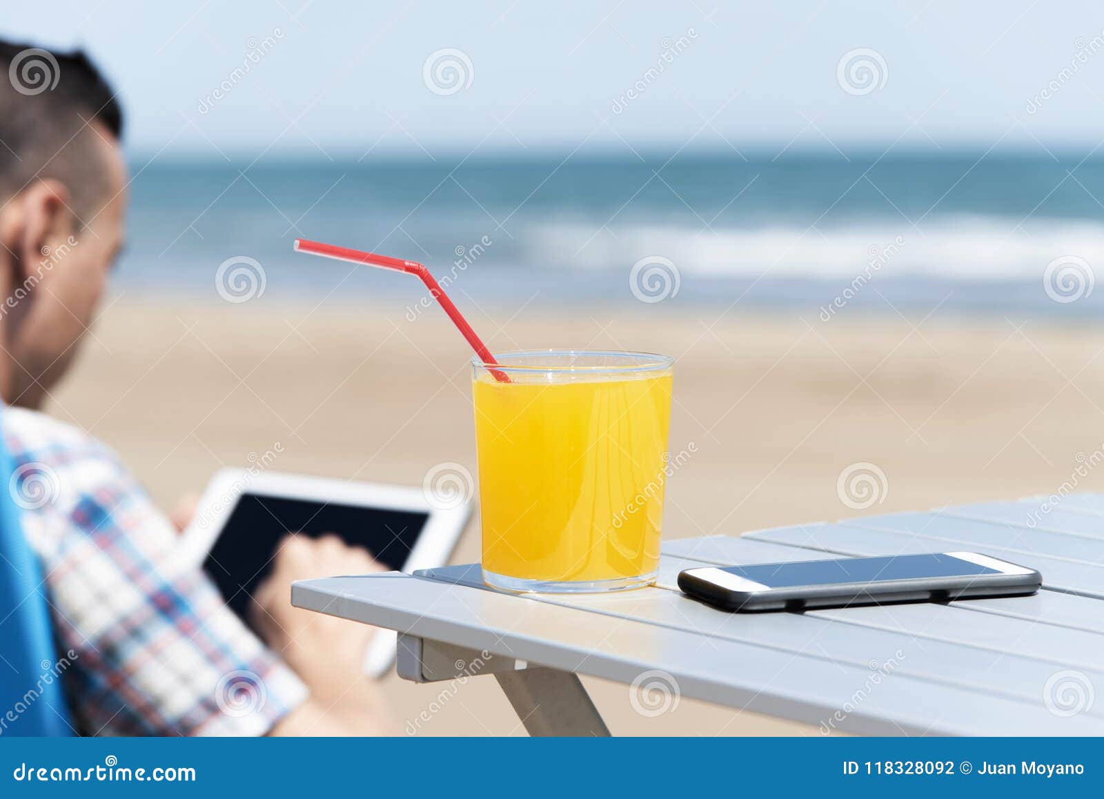 Man Using a Tablet on the Beach Stock Photo - Image of refreshing ...