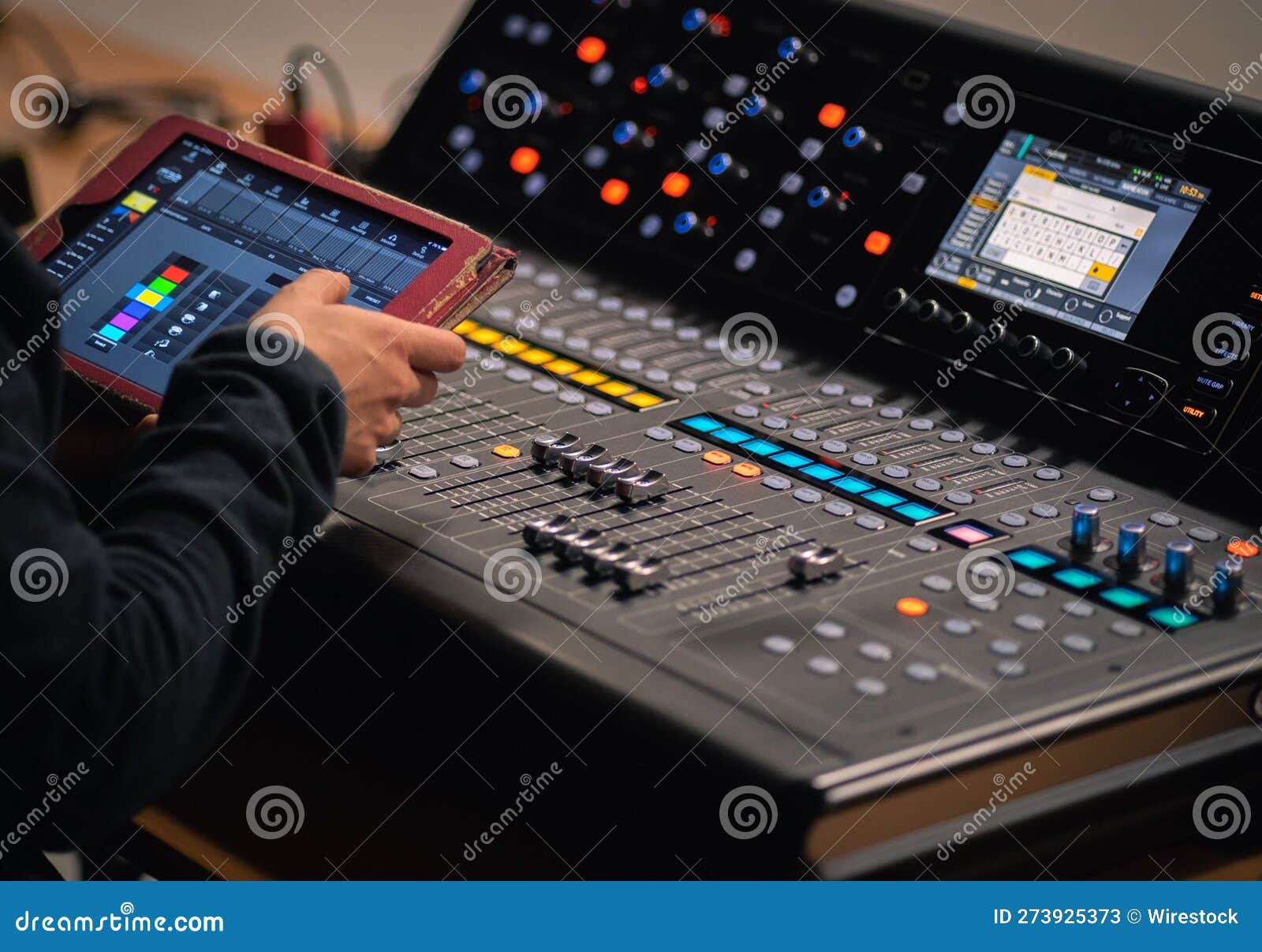 Man is Using a Tablet Computer in a Professional Environment Next To an ...