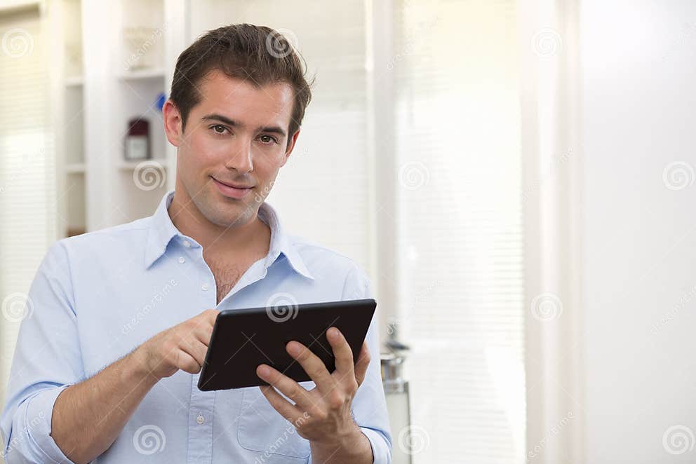 Man using tablet pc indoor stock image. Image of holding - 33172469