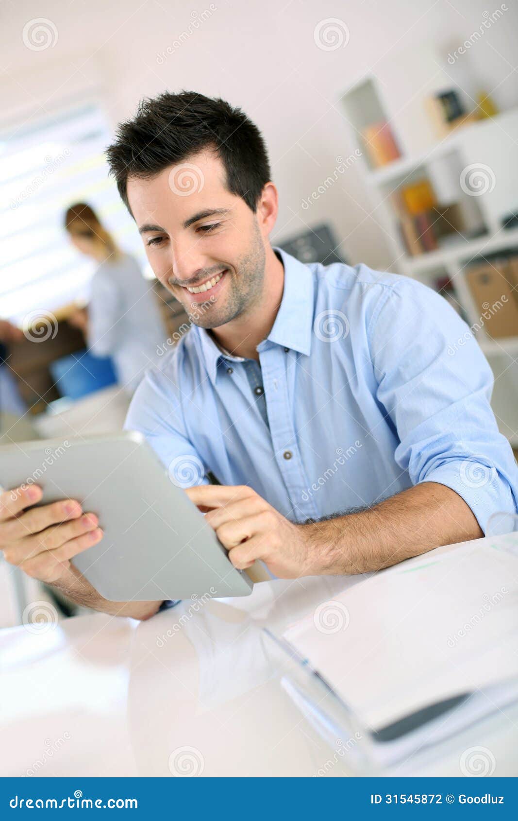 Man using tablet at work stock photo. Image of casual - 31545872