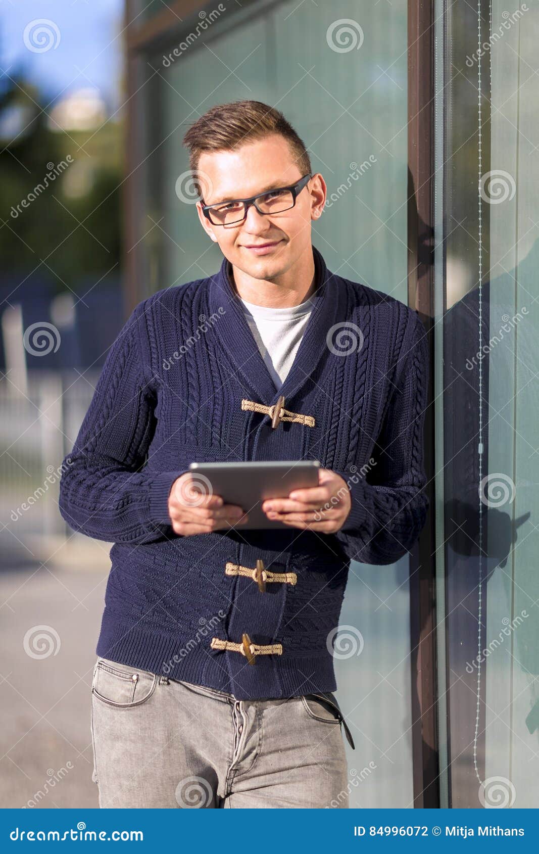 Man using a tablet stock photo. Image of person, tablet - 84996072