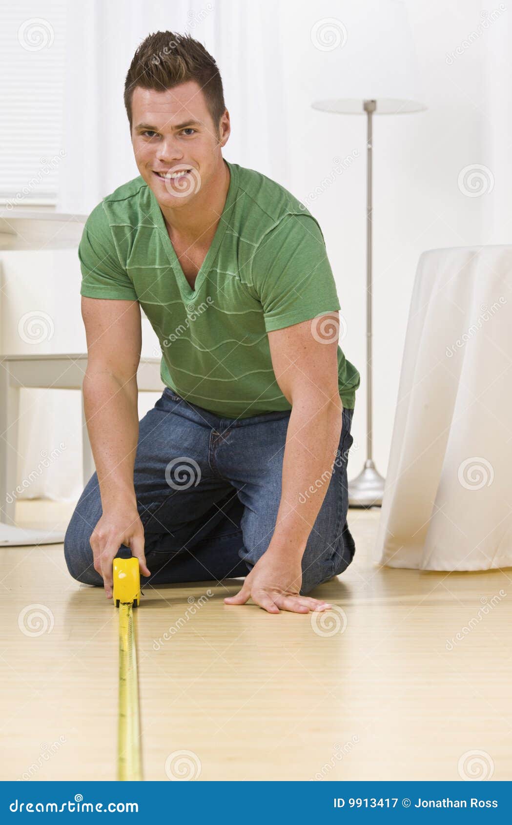 Man Using Tape Measure stock image. Image of inside, male - 9913417