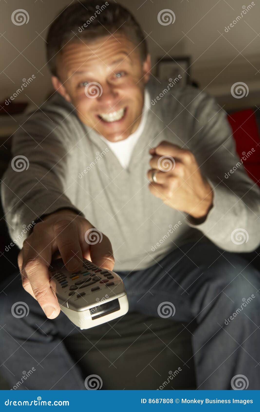 Man Using Television Remote Control Stock Photo - Image of excitement ...