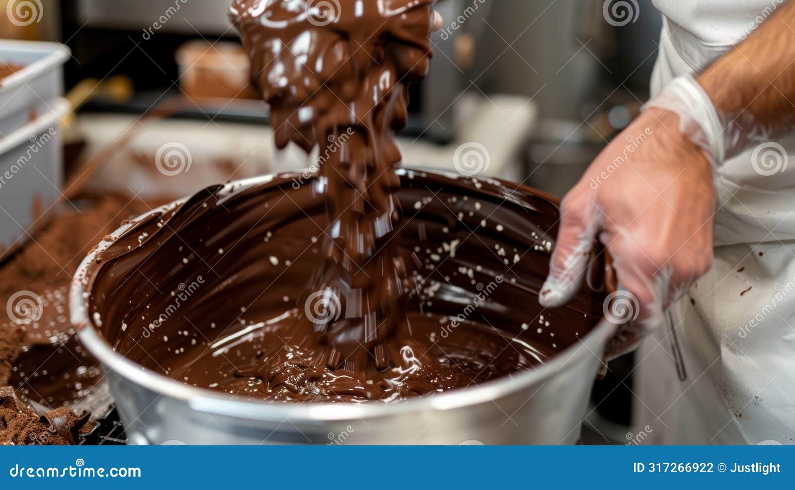 A Man Using a Tempering Machine To Melt and Cool Chocolate To the ...