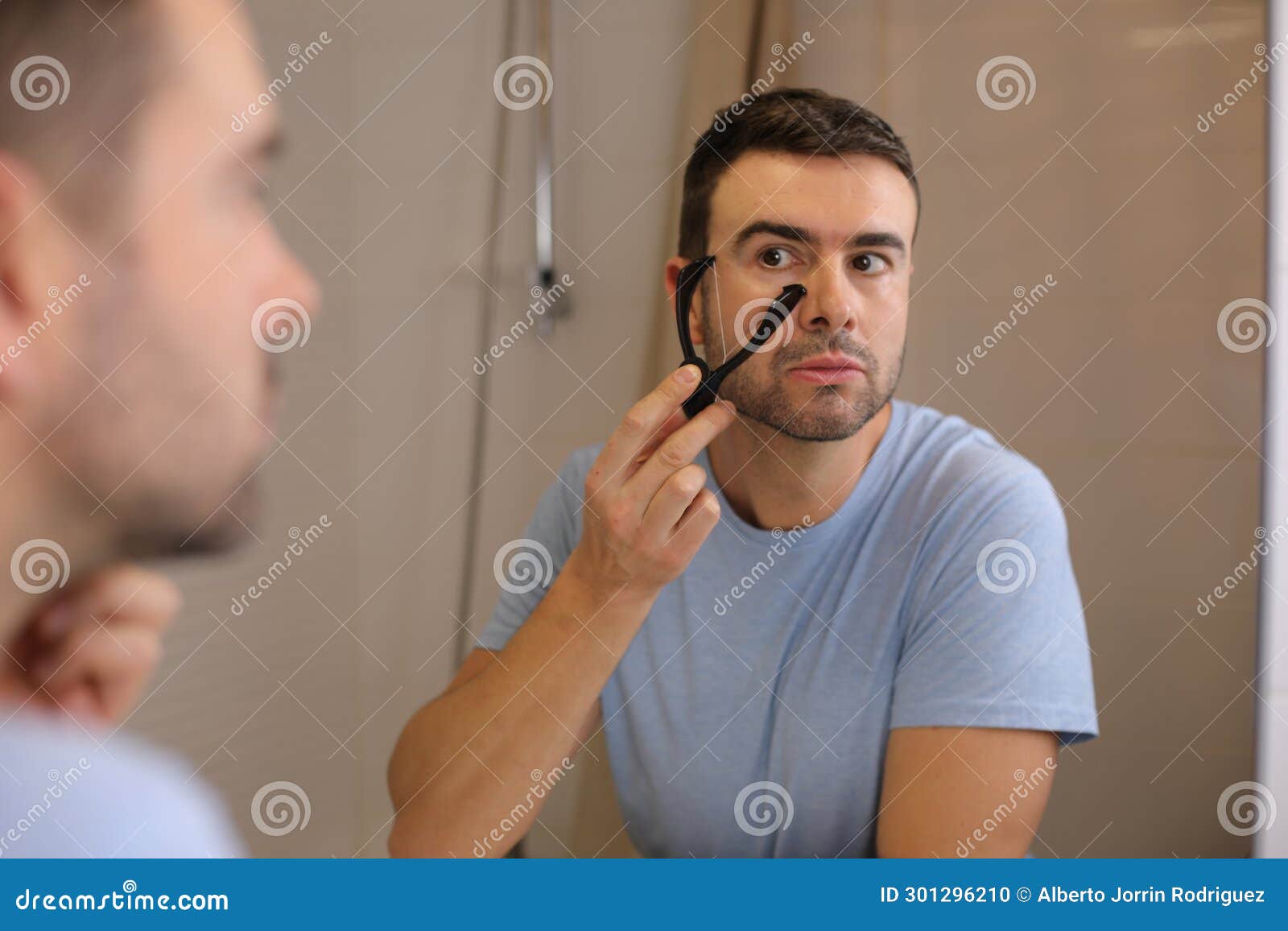 Man Using Threading As a Method for Hair Removal Stock Photo - Image of ...