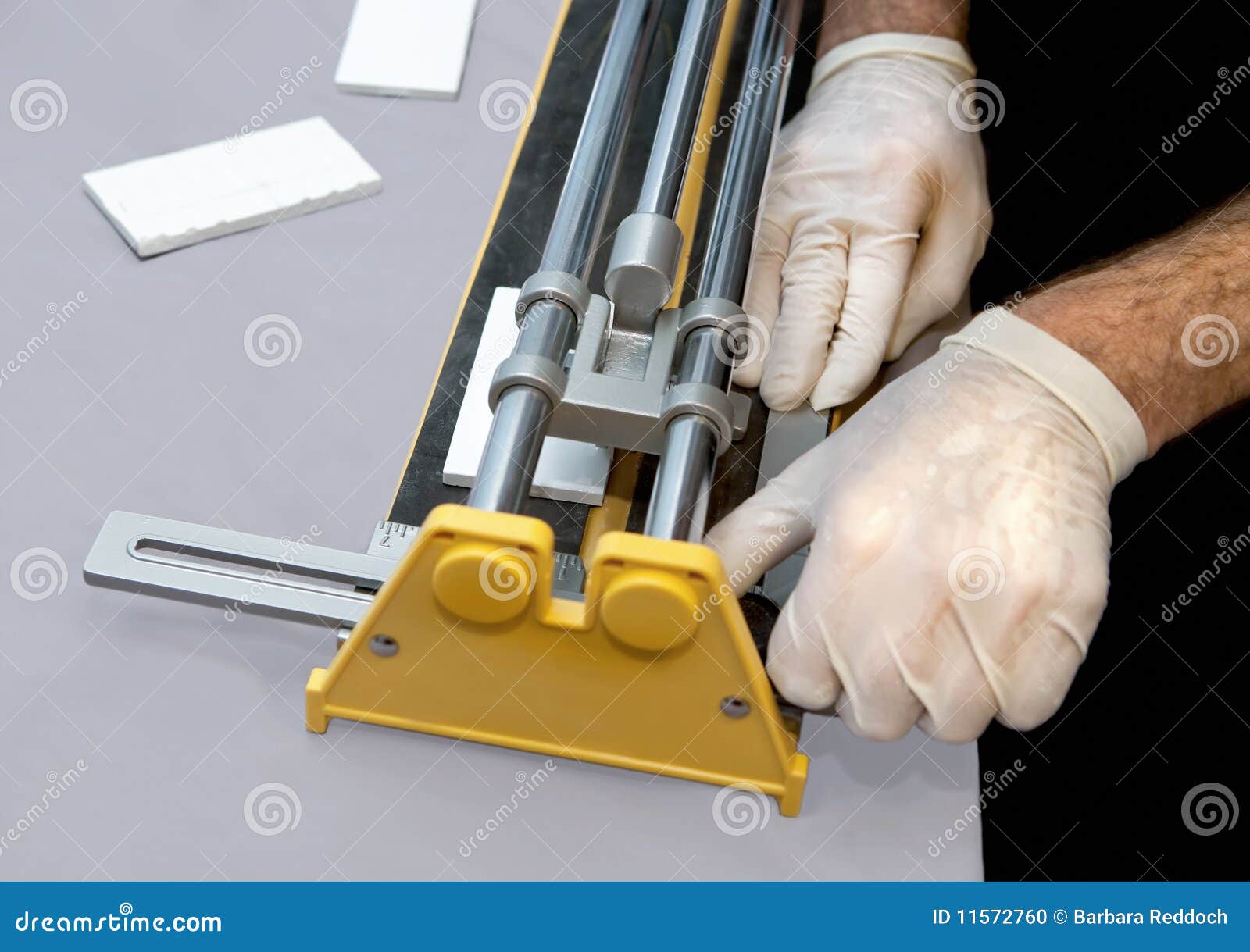 Man Using Tile Cutter stock photo. Image of household - 11572760