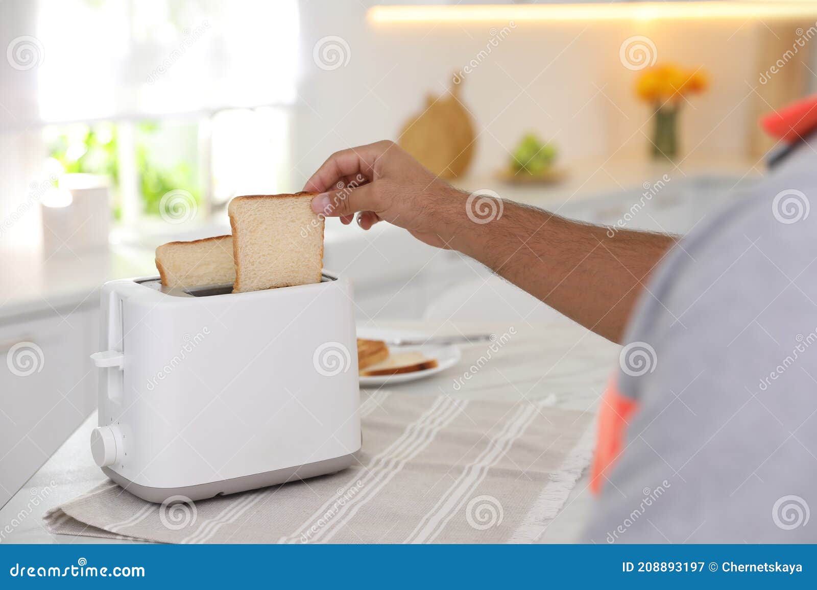 Man Using Toaster at Table in Kitchen, Closeup Stock Image - Image of ...