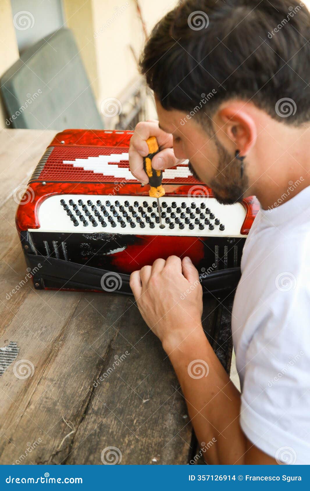 Man Using Tool To Fix and Tune Accordion Stock Photo - Image of ...