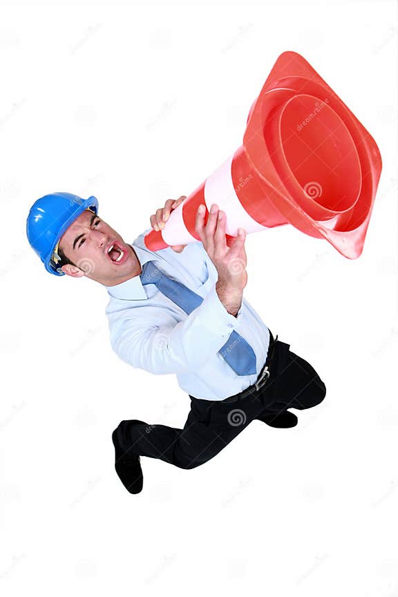 Man using a traffic cone stock image. Image of announce - 29641661