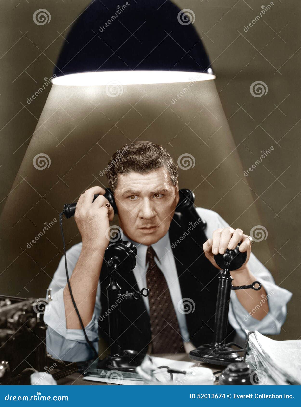 Man using two telephones stock photo. Image of communicate - 52013674