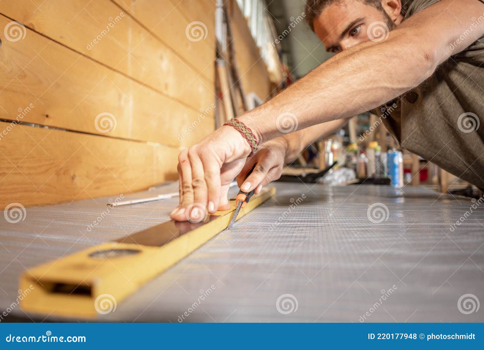 Man Cutting Insulation Material on a Workbench Stock Photo - Image of ...