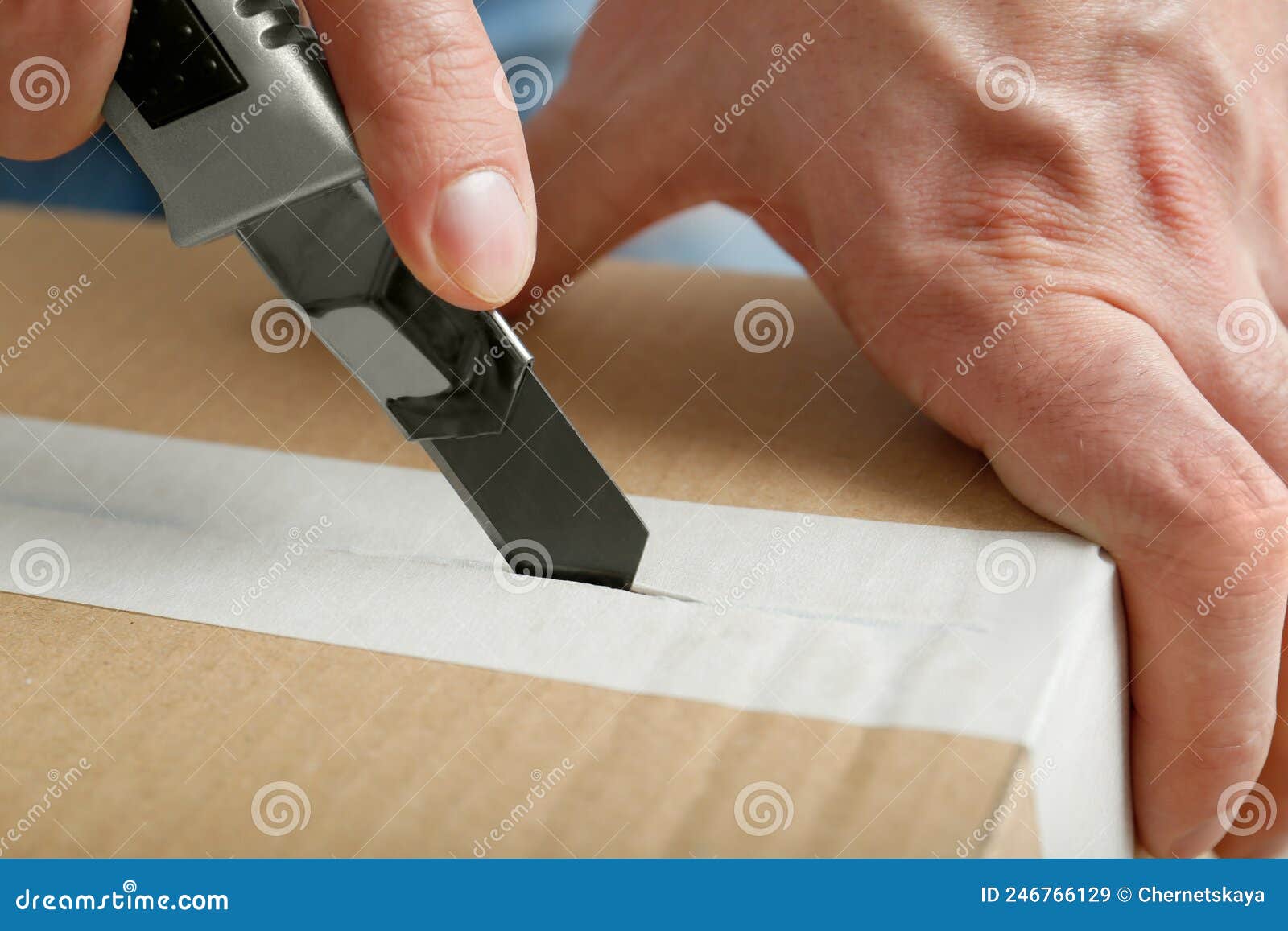 Man Using Utility Knife To Open Parcel, Closeup Stock Image - Image of ...