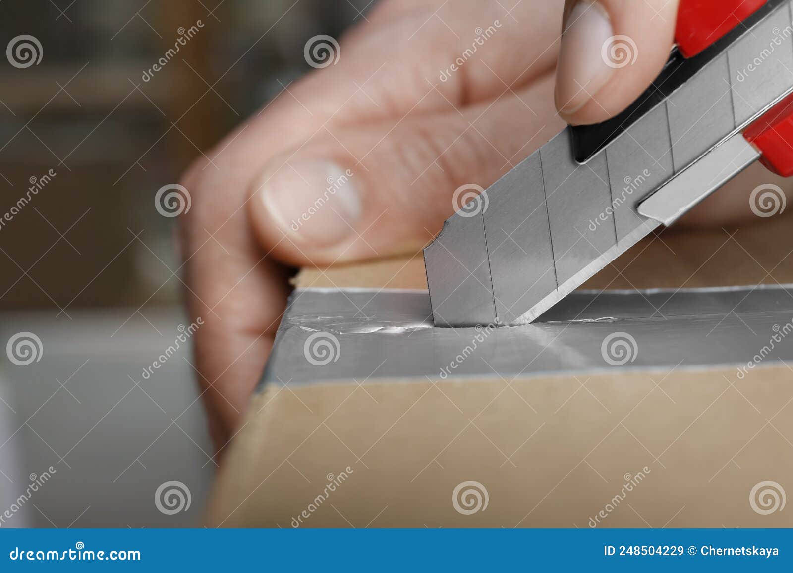 Man Using Utility Knife To Open Parcel, Closeup Stock Image - Image of ...