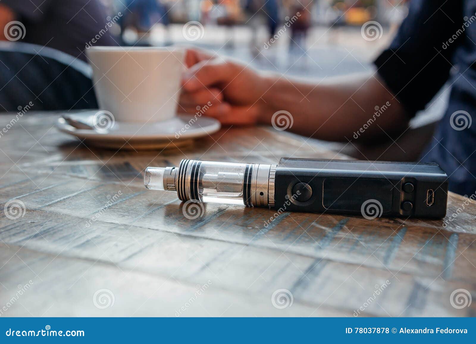 Man Using Vape or Electronic Cigarette and Drinking Coffee Stock Photo ...