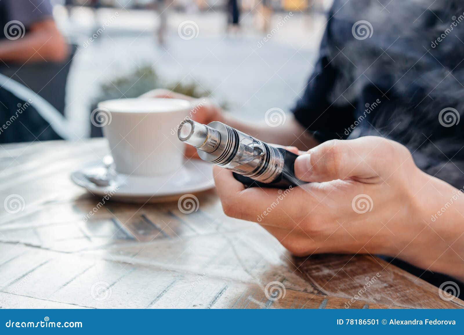 Man Using Vape or Electronic Cigarette and Drinking Coffee Stock Image ...