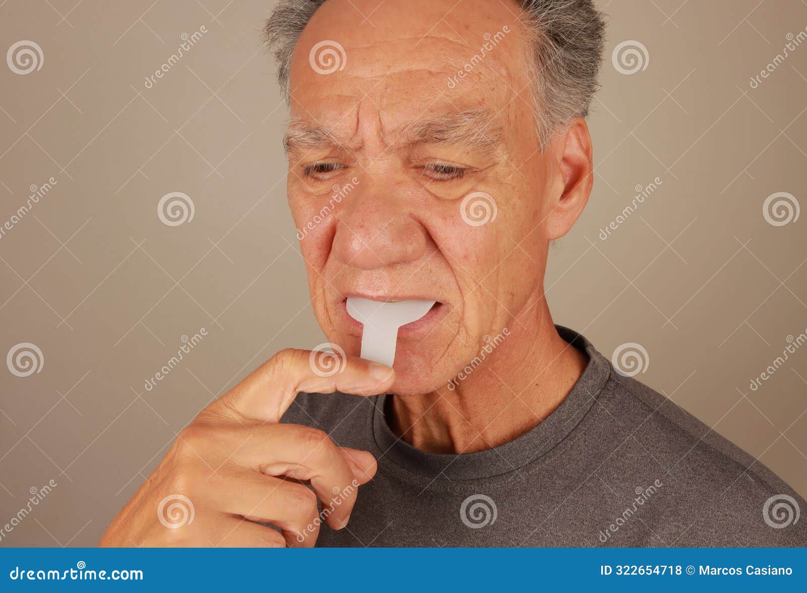 Man Using a Vibration Bite Device for Pain Relief Stock Photo - Image ...