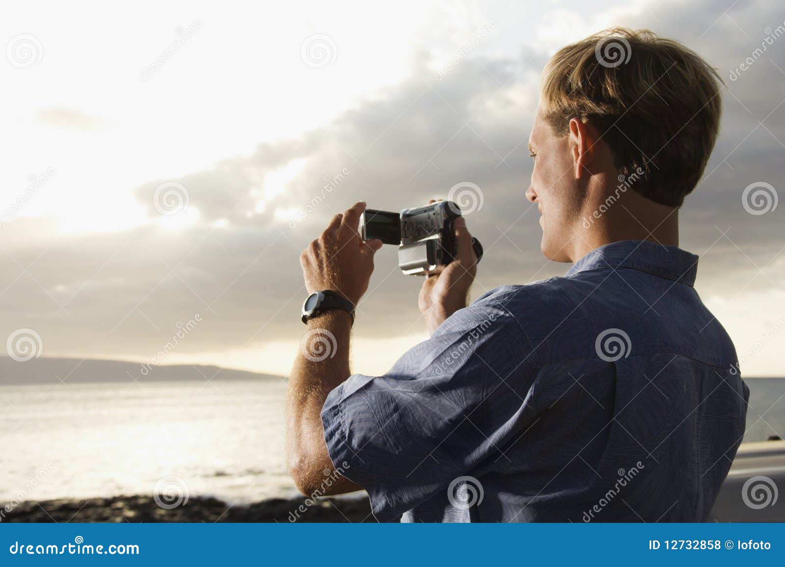 Man Using Video Camera at the Beach Stock Photo - Image of camera ...