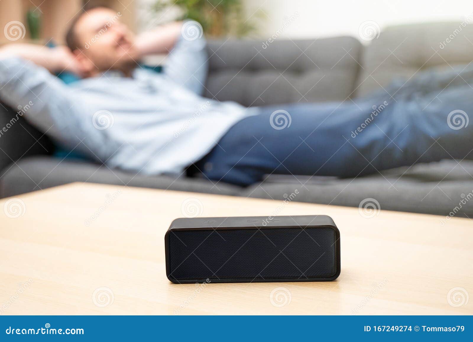 Man Using Virtual Assistant and Smart Speaker at Home Stock Photo ...