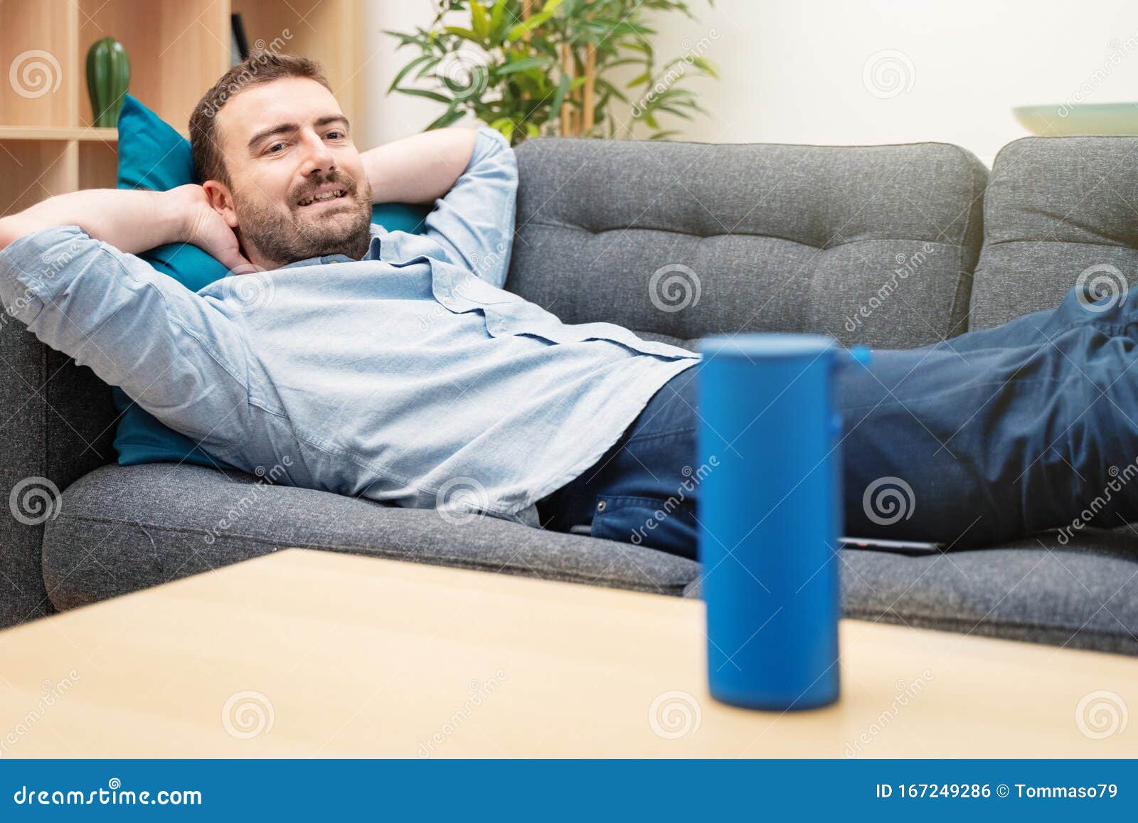 Man Using Virtual Assistant and Smart Speaker at Home Stock Photo ...