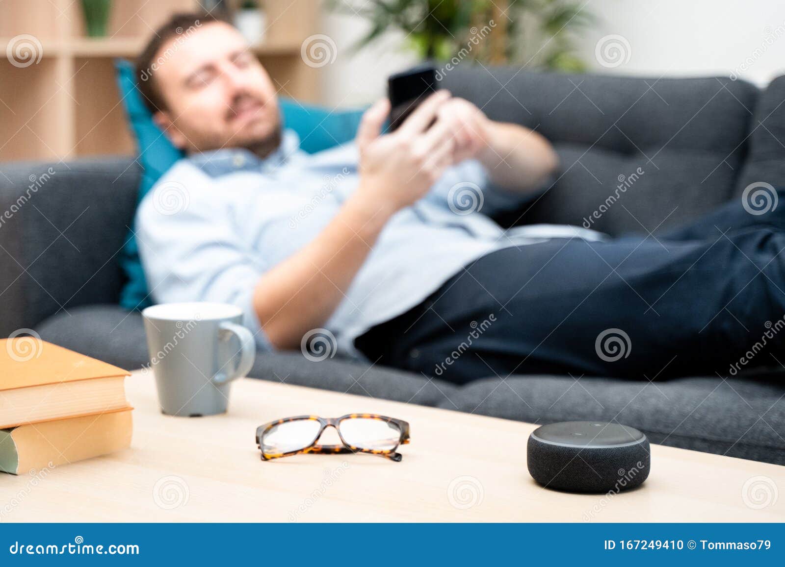Man Using Virtual Assistant and Smart Speaker at Home Stock Photo ...
