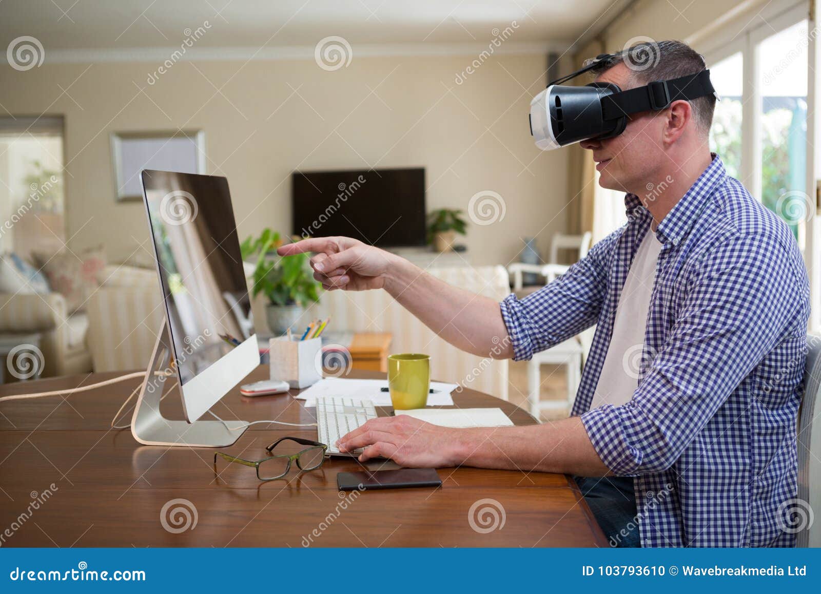 Man Using Virtual Reality Headset in Living Room Stock Photo - Image of ...