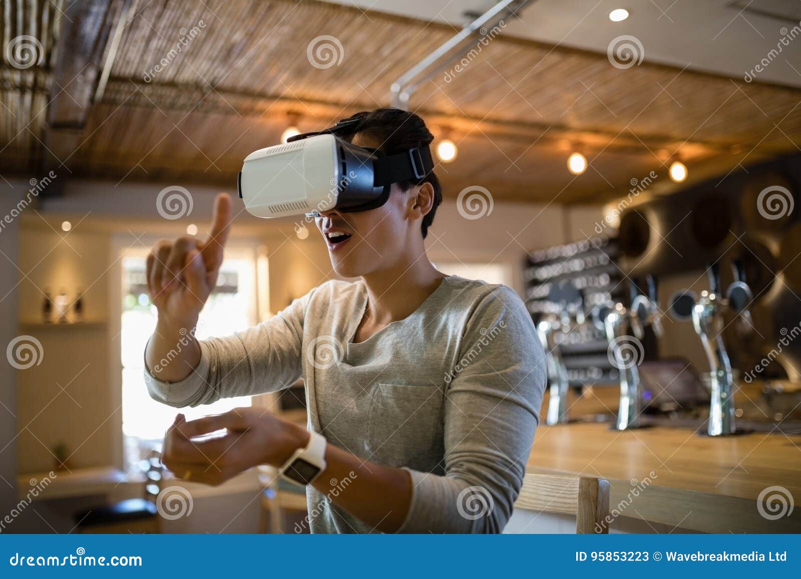Man Using Virtual Reality Headset in Restaurant Stock Image - Image of ...