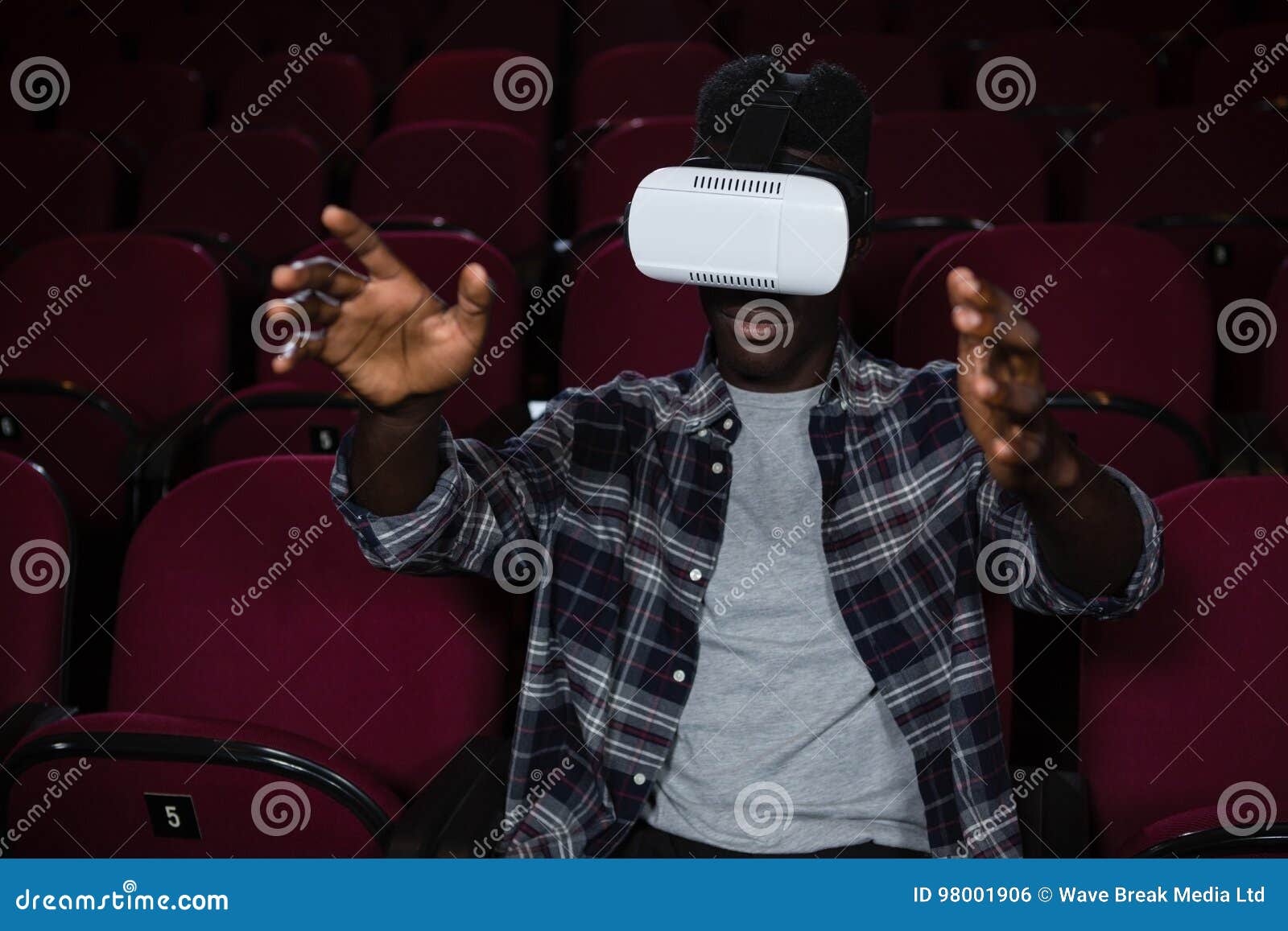 Man Using Virtual Reality Headset while Watching Movie Stock Photo ... Man Using Virtual Reality Headset while Watching Movie Stock Photo ...