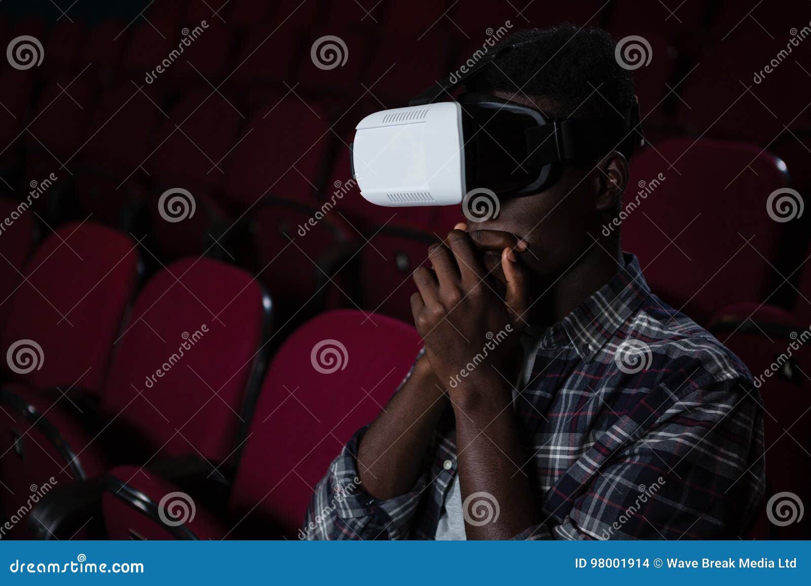 Man Using Virtual Reality Headset while Watching Movie Stock Photo ... Man Using Virtual Reality Headset while Watching Movie Stock Photo ...