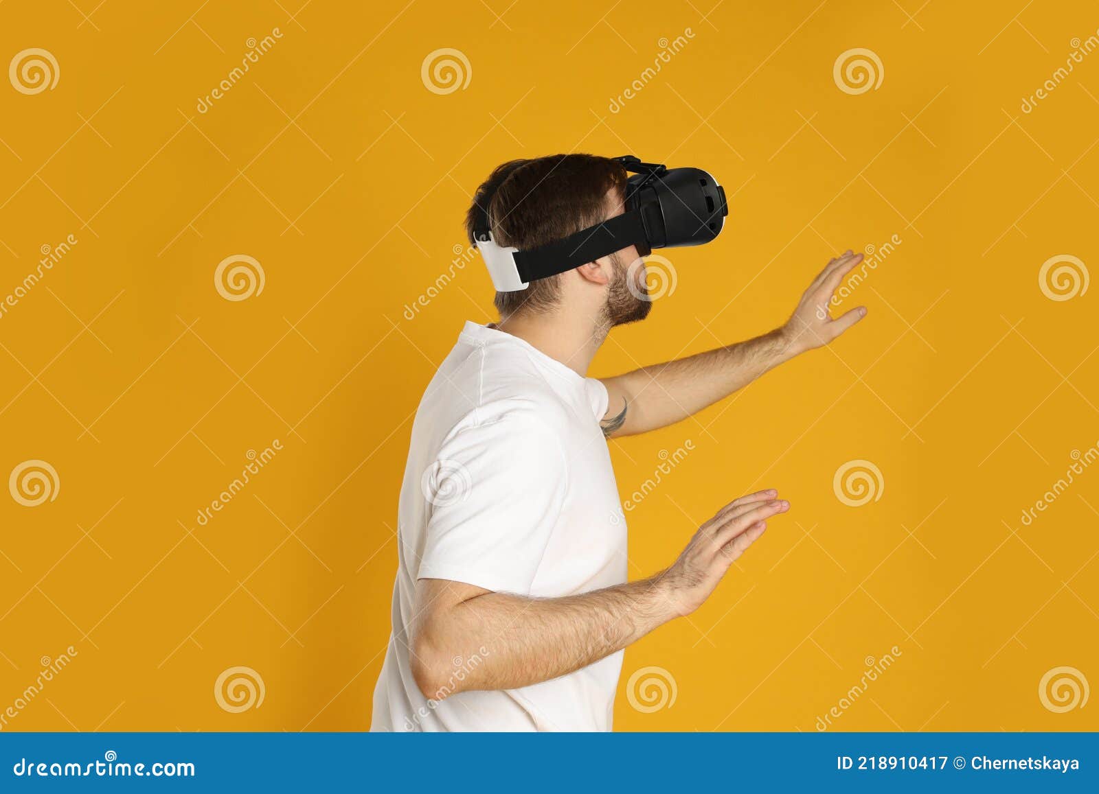 Man Using Virtual Reality Headset on Yellow Background Stock Image ...