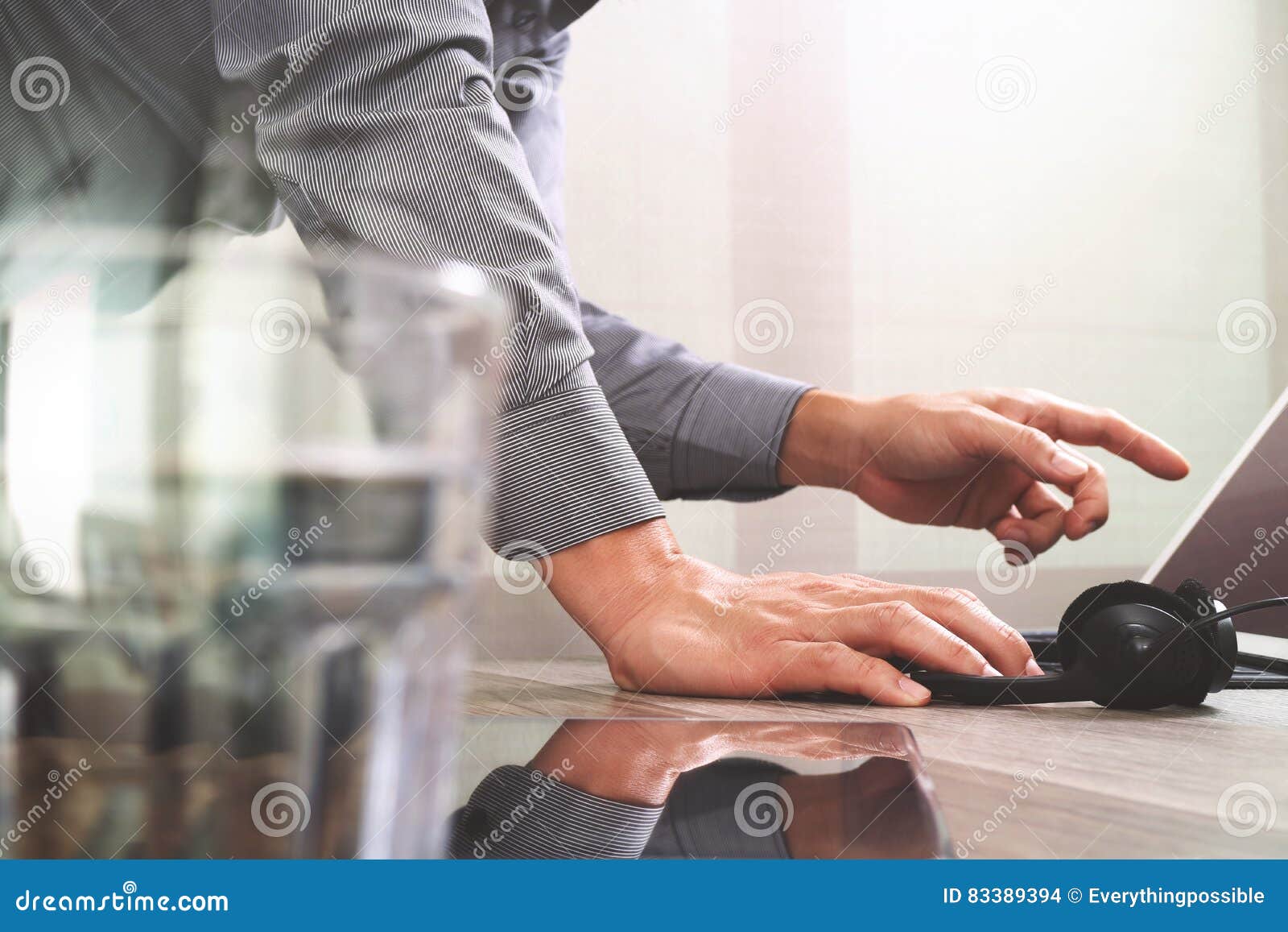 Man Using VOIP Headset with Digital Tablet Computer Docking Smart ...